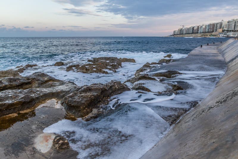 Waves on the breakwater stock image. Image of infinity - 68250367