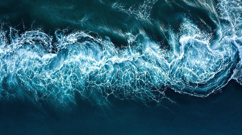 Waves Colliding in the Ocean Creating Swirling Patterns Stock ...