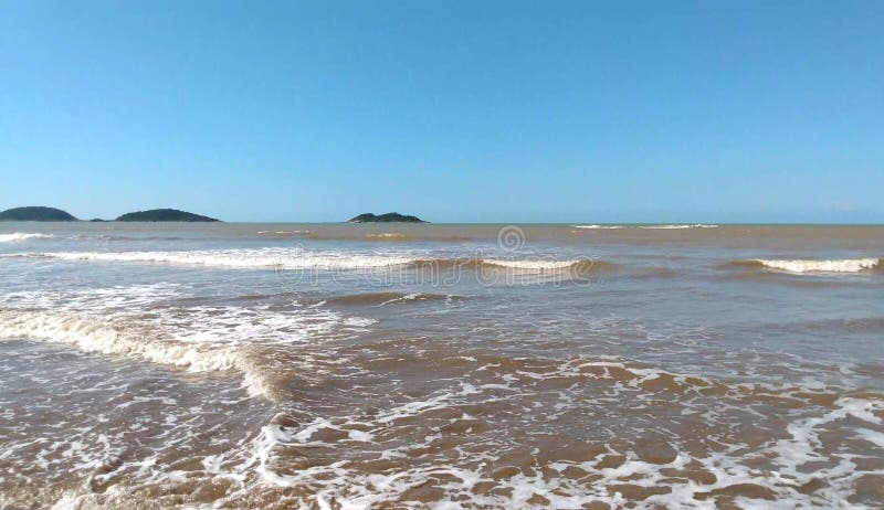 Waves come and go stock photo. Image of sand, water - 263210586