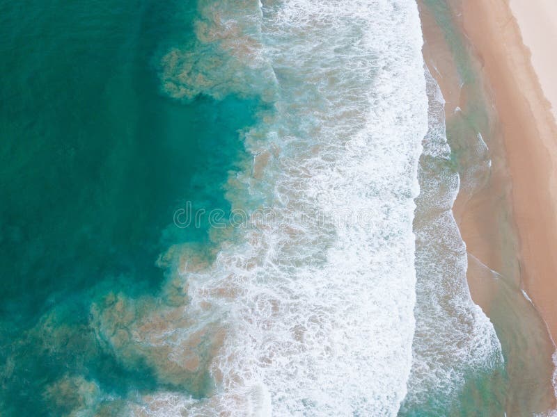 Waves coming into beach stock photo. Image of surf, sand - 186186554