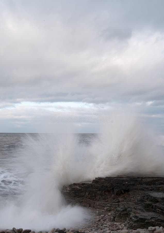 Waves Crash on the Rocks. stock image. Image of capture - 87979005