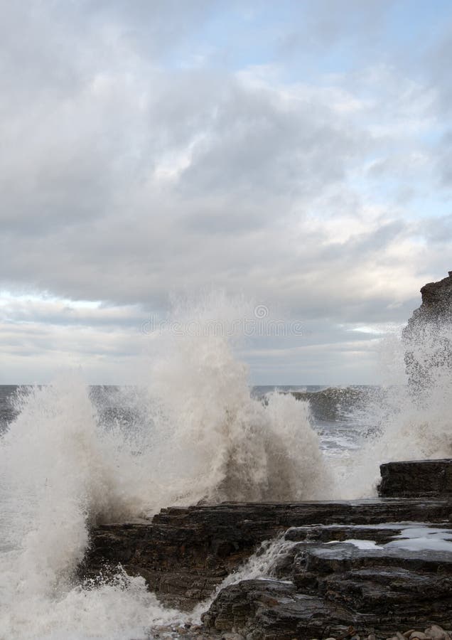 Waves Crash on the Rocks. stock image. Image of capture - 87979005
