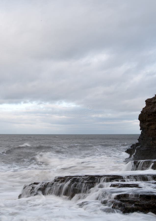 Waves Crash on the Rocks. stock image. Image of fishing - 87979249