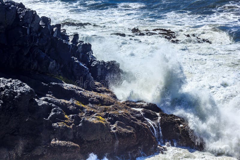 Waves crashed into rocks stock photo. Image of nature - 116422472