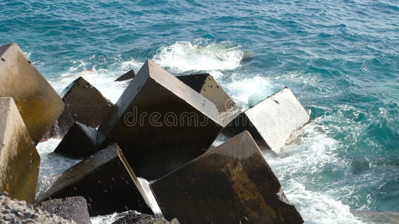 Waves Crashing Against Breakwater Concrete Blocks. Stock Video - Video ...