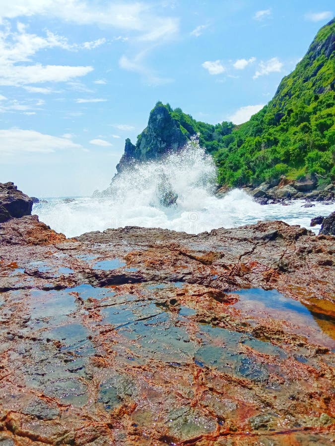 Waves Crashing Against Rocks on the Beach Stock Image - Image of ...
