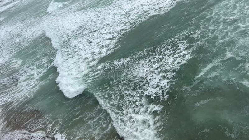 Waves Crashing on a Beach, Creating Foam and Splashes, Viewed from ...