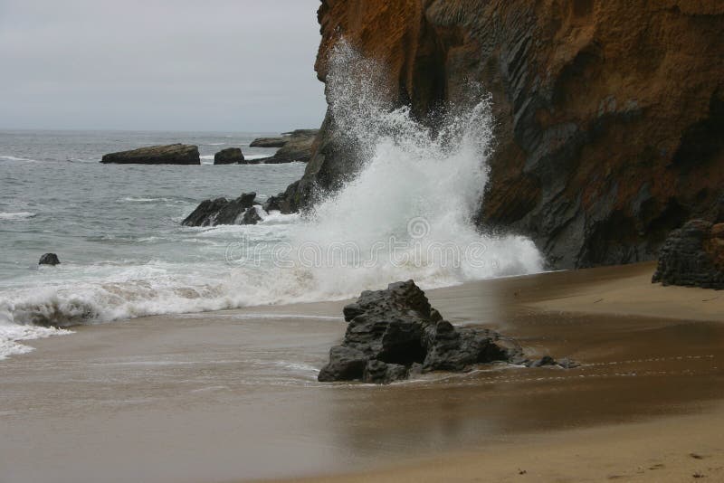 Waves crashing on cliff stock photo. Image of fierce, cliff - 61274
