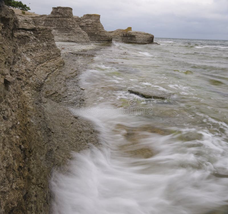 Waves crashing on cliffs stock image. Image of natural - 10765827