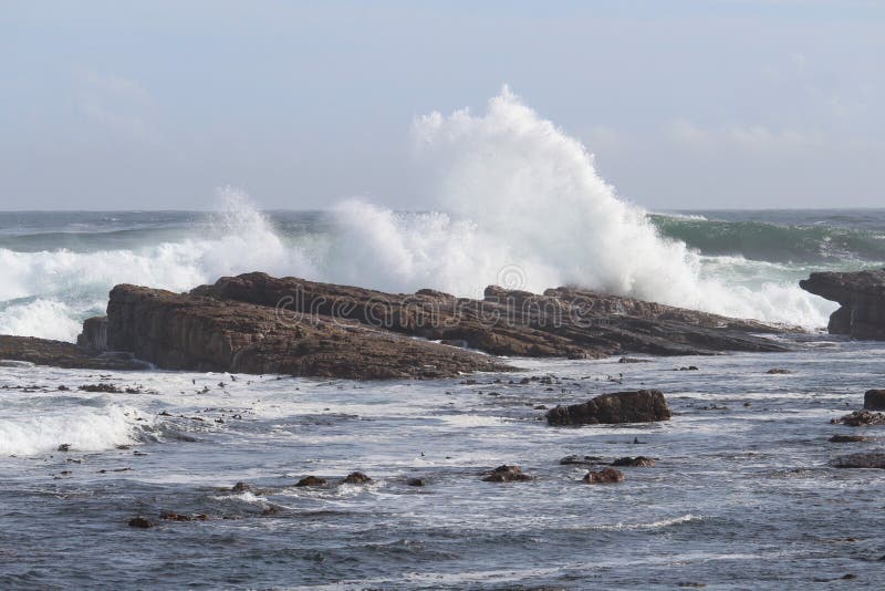Waves crashing on cliffs stock image. Image of nature - 178701613