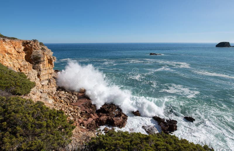 Waves crashing onto rocks stock image. Image of rocky - 213021259