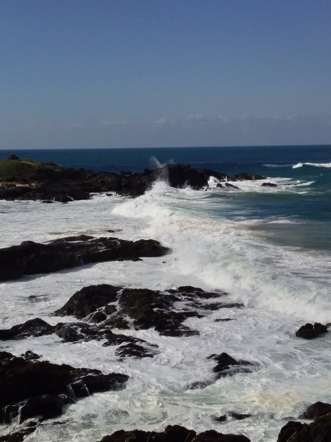 Waves Crashing Onto Rocks stock image. Image of background - 155793995