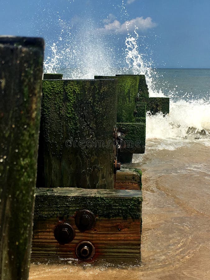 Waves Crashing Over Pier stock photo. Image of pier, dock - 79017930