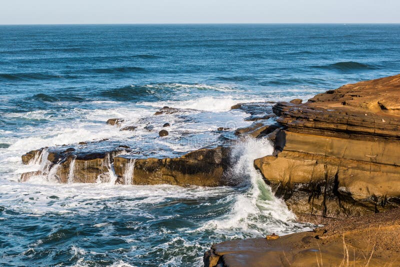 Waves Crashing Over Rock Formations at Sunset Cliffs Stock Photo ...