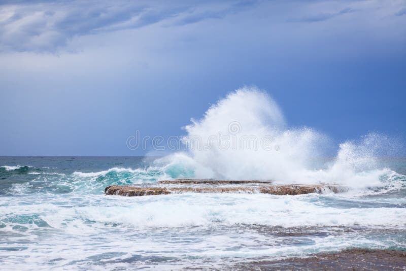 Waves crashing on rock stock image. Image of splashing - 96846159