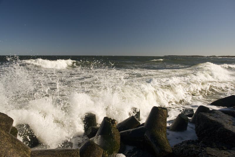 Waves crashing into rocks stock photo. Image of coastline - 2287328