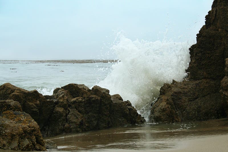 Waves Crashing on the Rocks at the Beach Stock Photo - Image of rugged ...