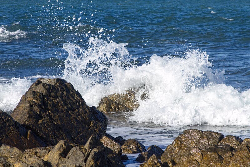 Waves crashing on rocks stock photo. Image of natural - 94824358