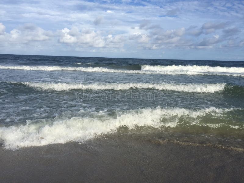 Waves crashing on the sand stock photo. Image of freshness - 107448562