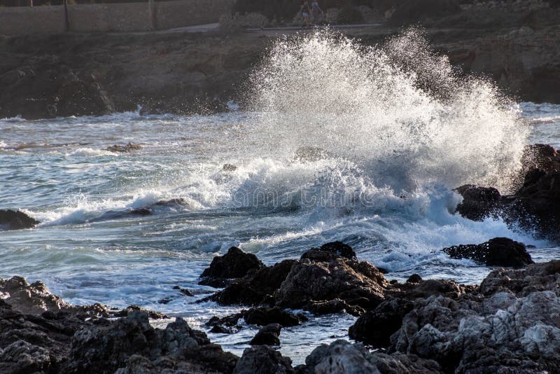 Waves Crashing To Some Rocks at the Coast Shore Stock Image - Image of ...