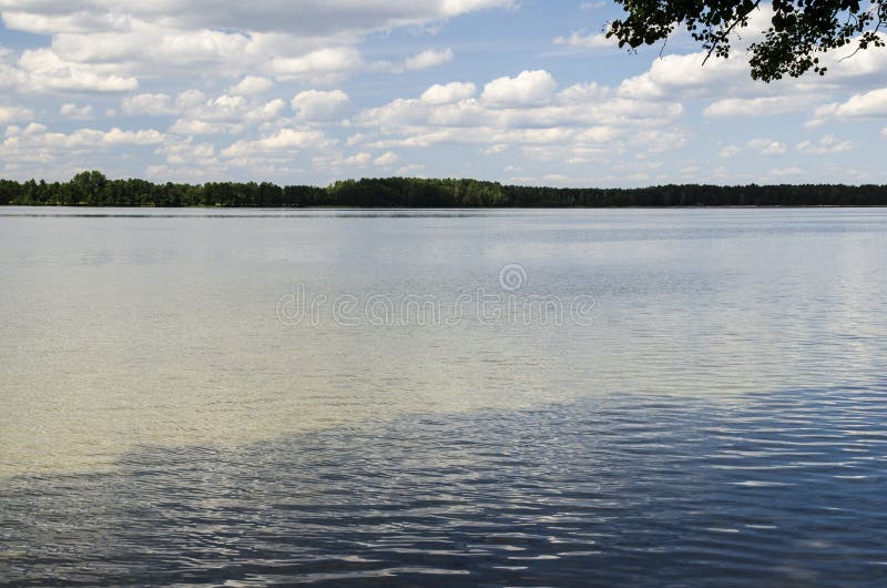 Waves in the evening lake stock image. Image of blue - 96135937