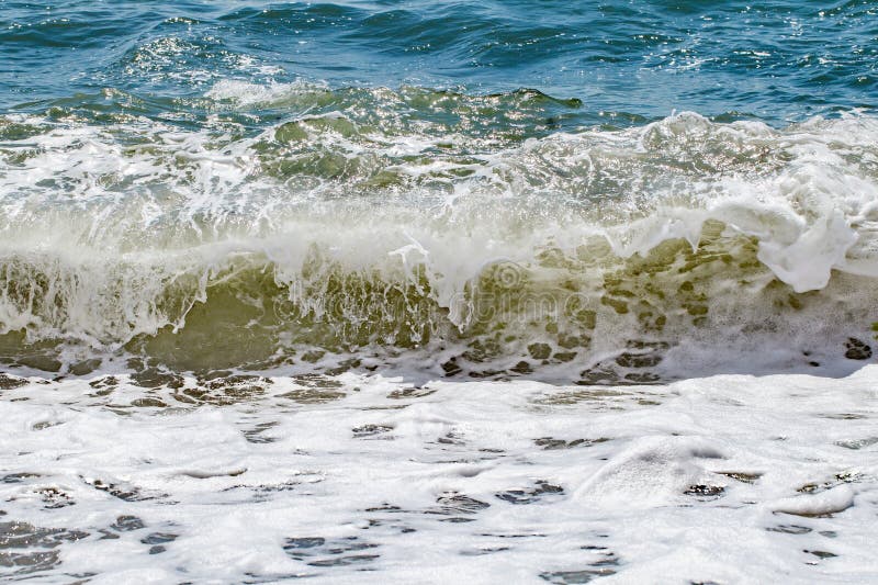 Waves with Foam Roll on the Seashore Close-up Stock Photo - Image of ...