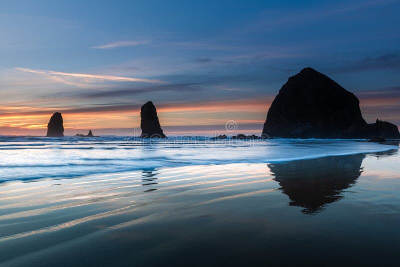 Waves in Front of Cannon Beach Haystack at Blue Hour Stock Photo ...
