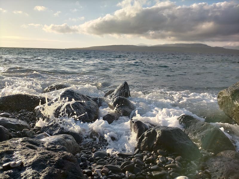 The Waves Hit the Rock Creating a Splash of Hard Water Stock Photo ...