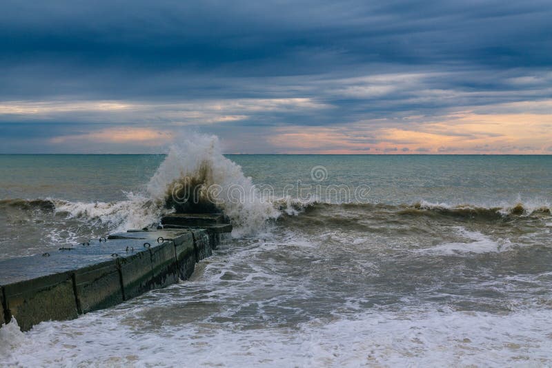 Waves Hit the Stone Sea Pier. Splashes Scatter in All Directions Stock ...