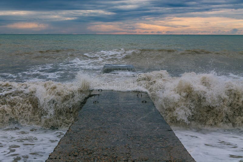Waves Hit the Stone Sea Pier. Splashes Scatter in All Directions Stock ...