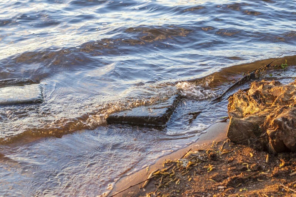 Waves Hitting the Concrete Blocks on the Bank of River. Concept Stock ...