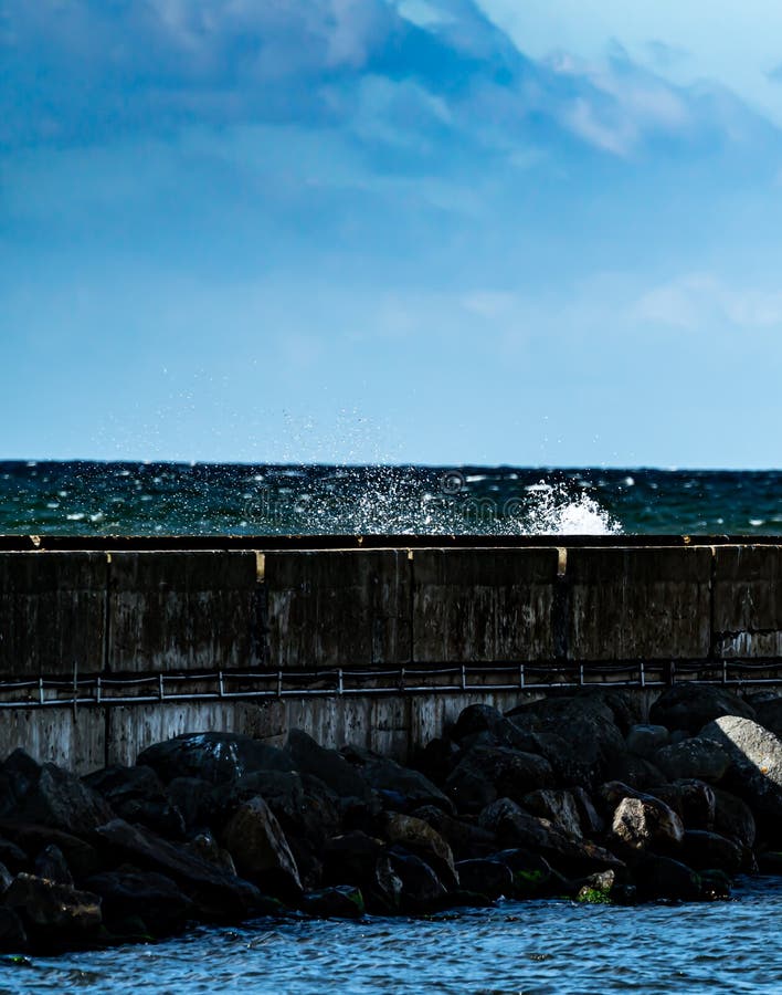 Waves hitting a pier stock photo. Image of foam, roaring - 197851228