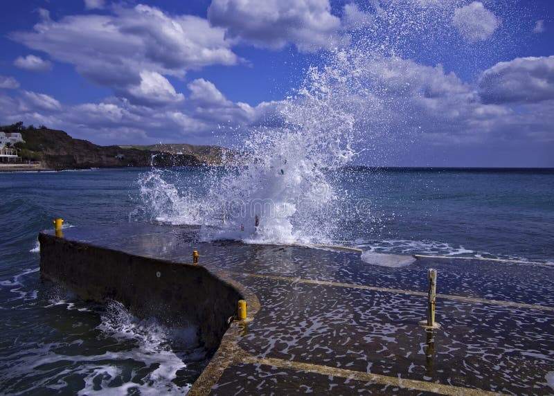 Waves Hitting a Pier stock image. Image of docks, shore - 72655187