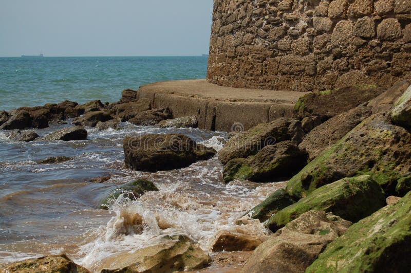 Waves hitting the rocks stock image. Image of beach, light - 55787909