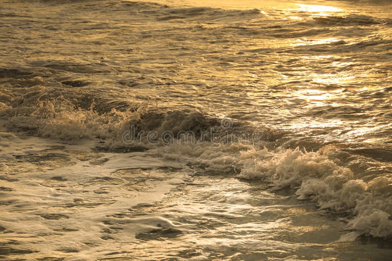 Waves Hitting the Rocks on the Shore on the Beach at Sunset Stock Image ...