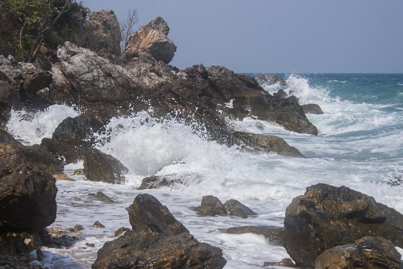 Waves hitting rocks stock photo. Image of waves, water - 37250810