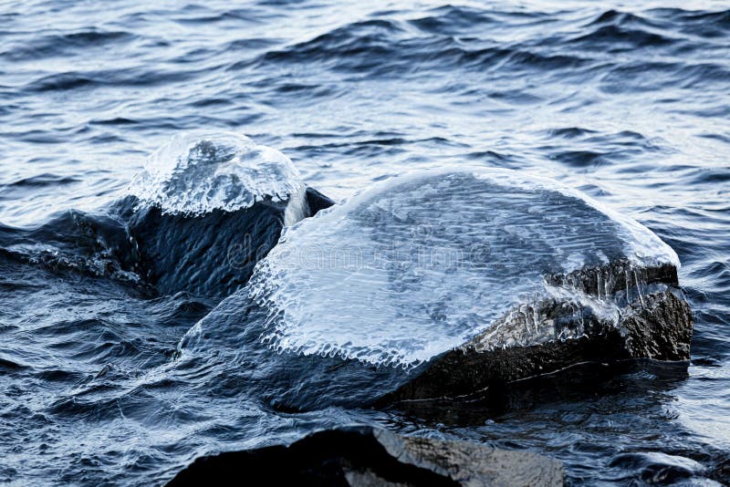 Ice Frozen Over Rocks in Lake Shore Stock Image - Image of natural ...