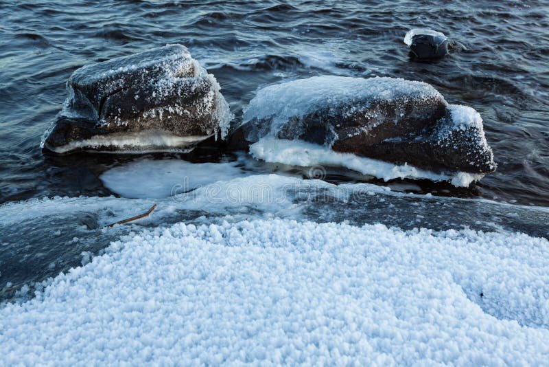 Ice Frozen Over Rocks in Lake Shore Stock Image - Image of freezing ...