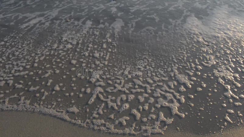Waves lapping the beach stock video. Video of calm, wave - 173329289