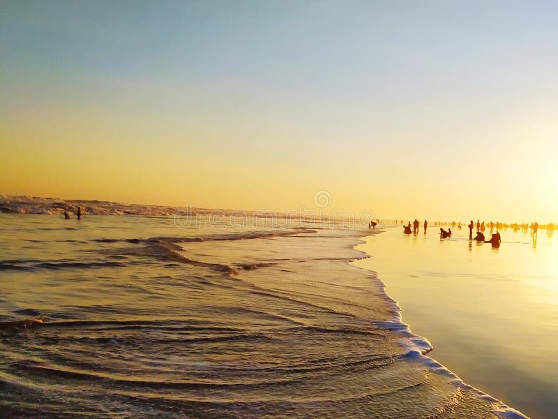 Waves in the Middle of the Beach at Sunset Stock Photo - Image of beach ...