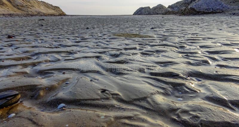 Waves on a Muddy Bottom in a Sea Channel at Low Tide Stock Photo ...