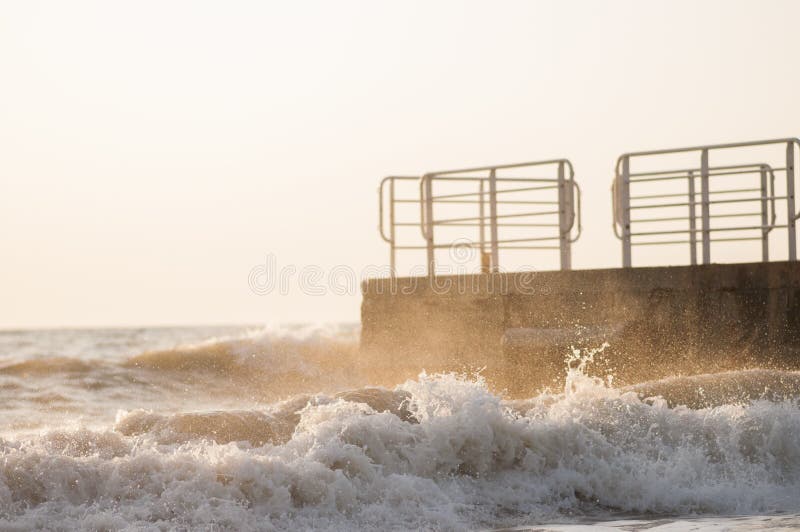 Waves near the pier stock image. Image of stormy, coast - 87775601