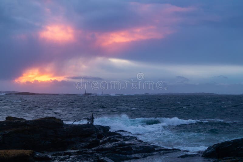 Waves from Ocean Hitting Rocks with Clouds an Sunset Editorial ...