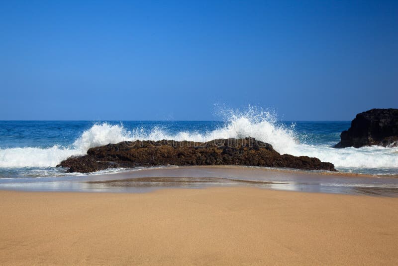 Waves Over Rocks on Lumahai Stock Photo - Image of beautiful, foam ...