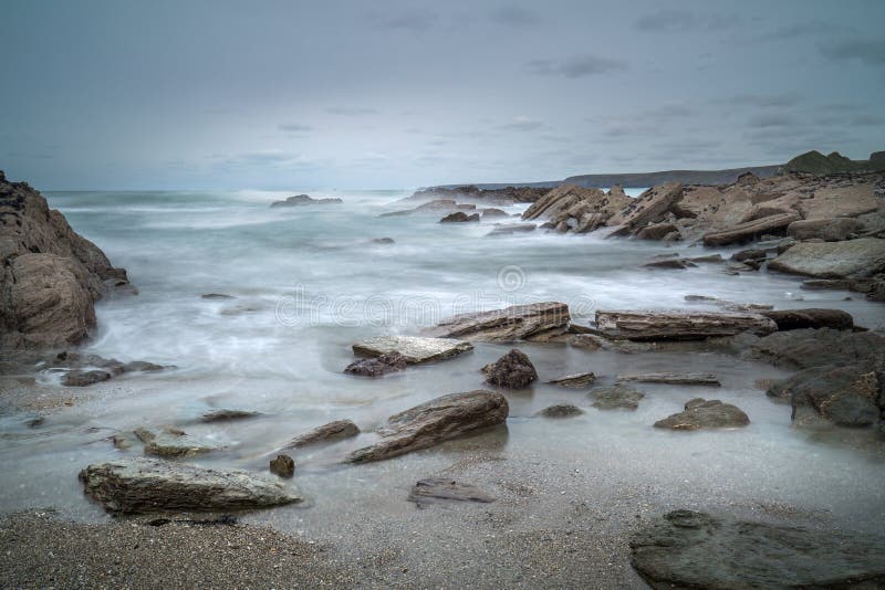 Waves Over Rocks, Porth Beach, Cornwall Stock Image - Image of swell ...