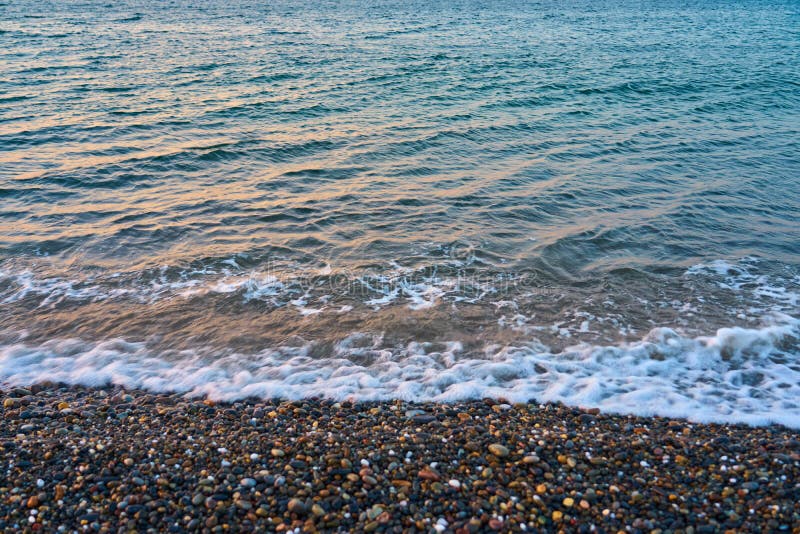 Waves on a Pebble Beach on a Sunset. Stock Photo - Image of pebble ...