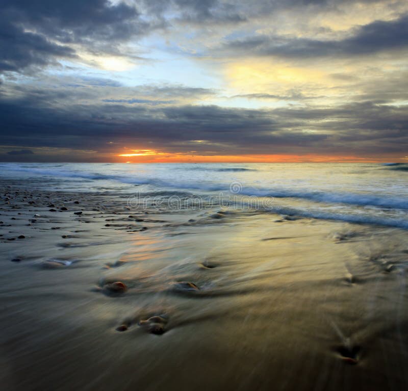 Pebbles at sunset stock image. Image of coast, light - 22808235