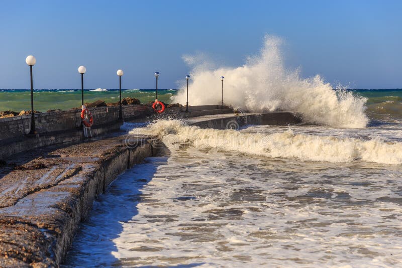 Waves at a pier stock image. Image of greece, pier, crete - 51065339