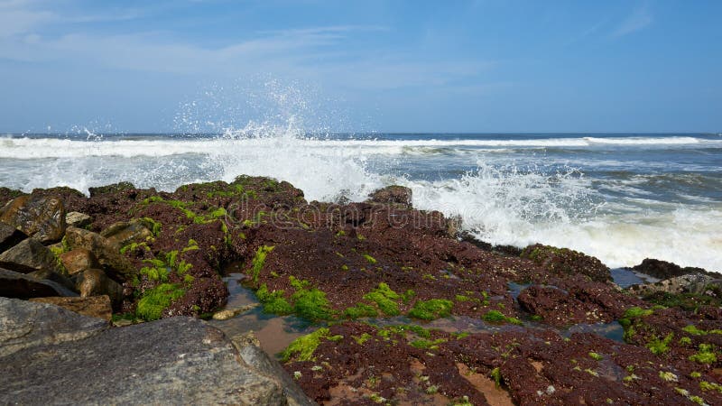 Waves Pounding Rocks on a Beach Stock Image - Image of green, tropical ...