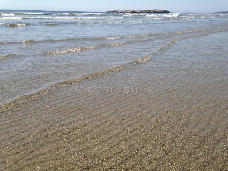 Waves and rippled sand stock photo. Image of clear, ocean - 117835150